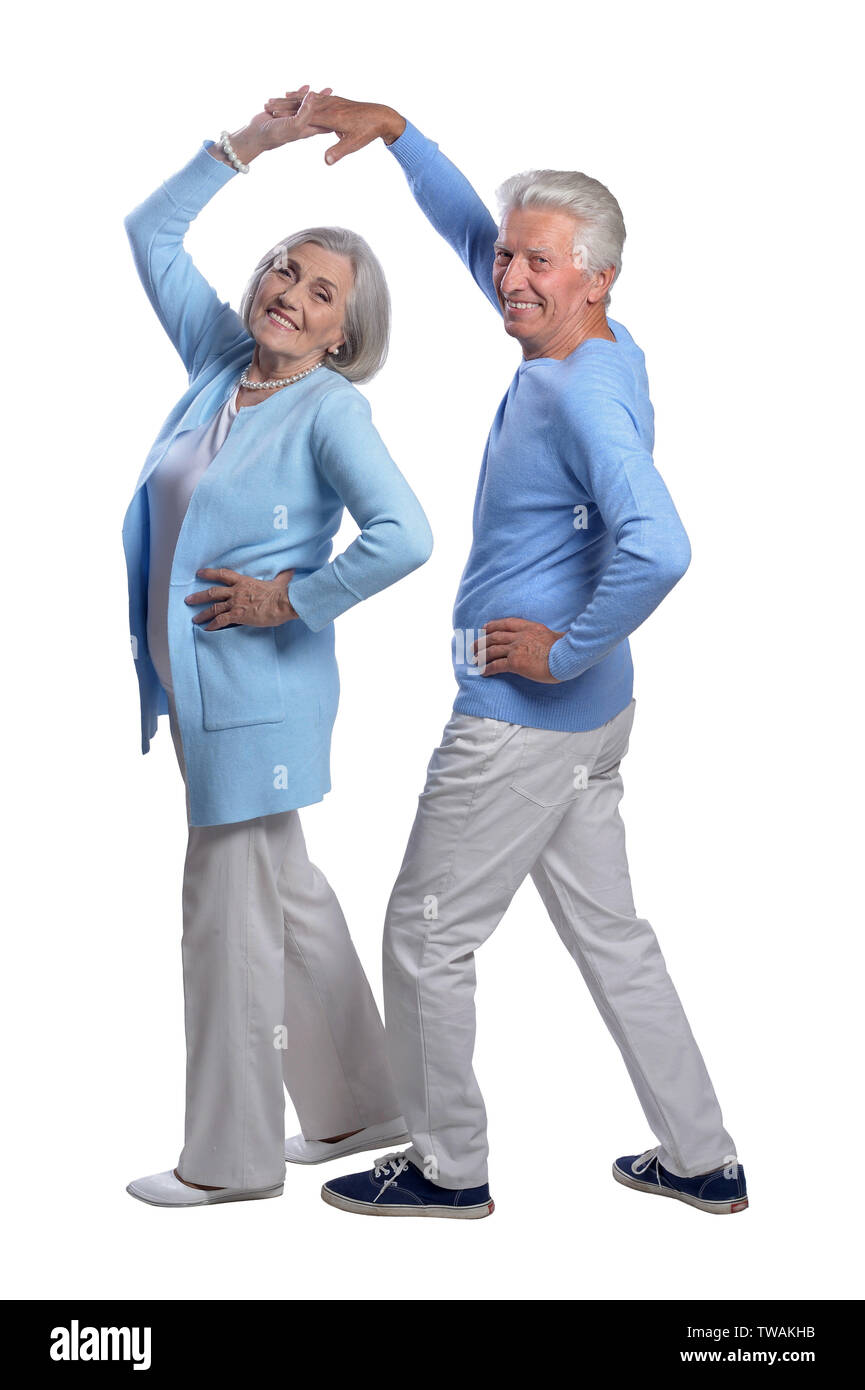 Happy senior couple dancing on white background Stock Photo - Alamy