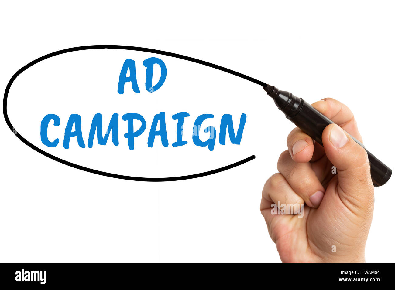 Closeup of man drawing circle around ad campaign text with black marker ...