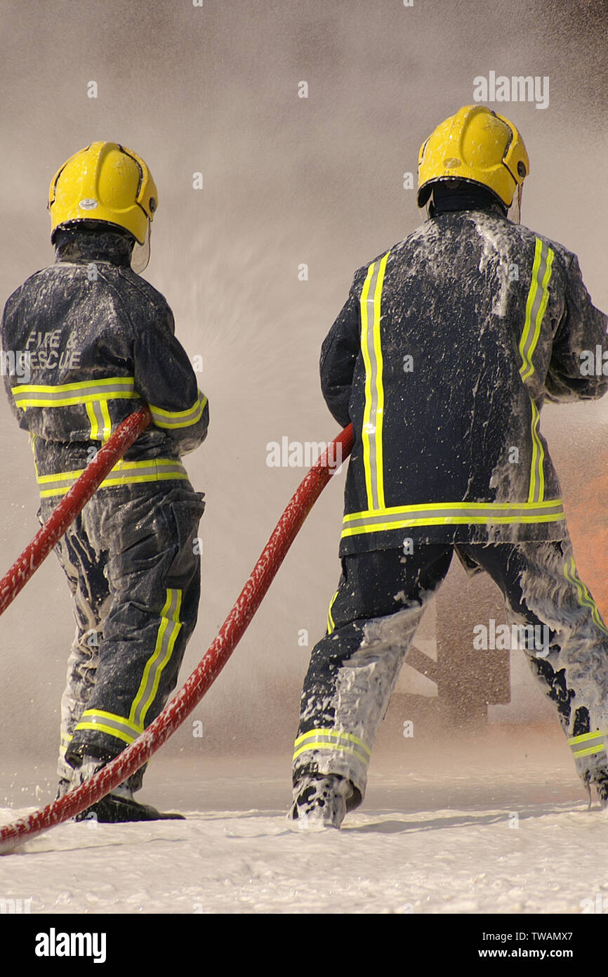 Firefighting hose team hi-res stock photography and images - Alamy