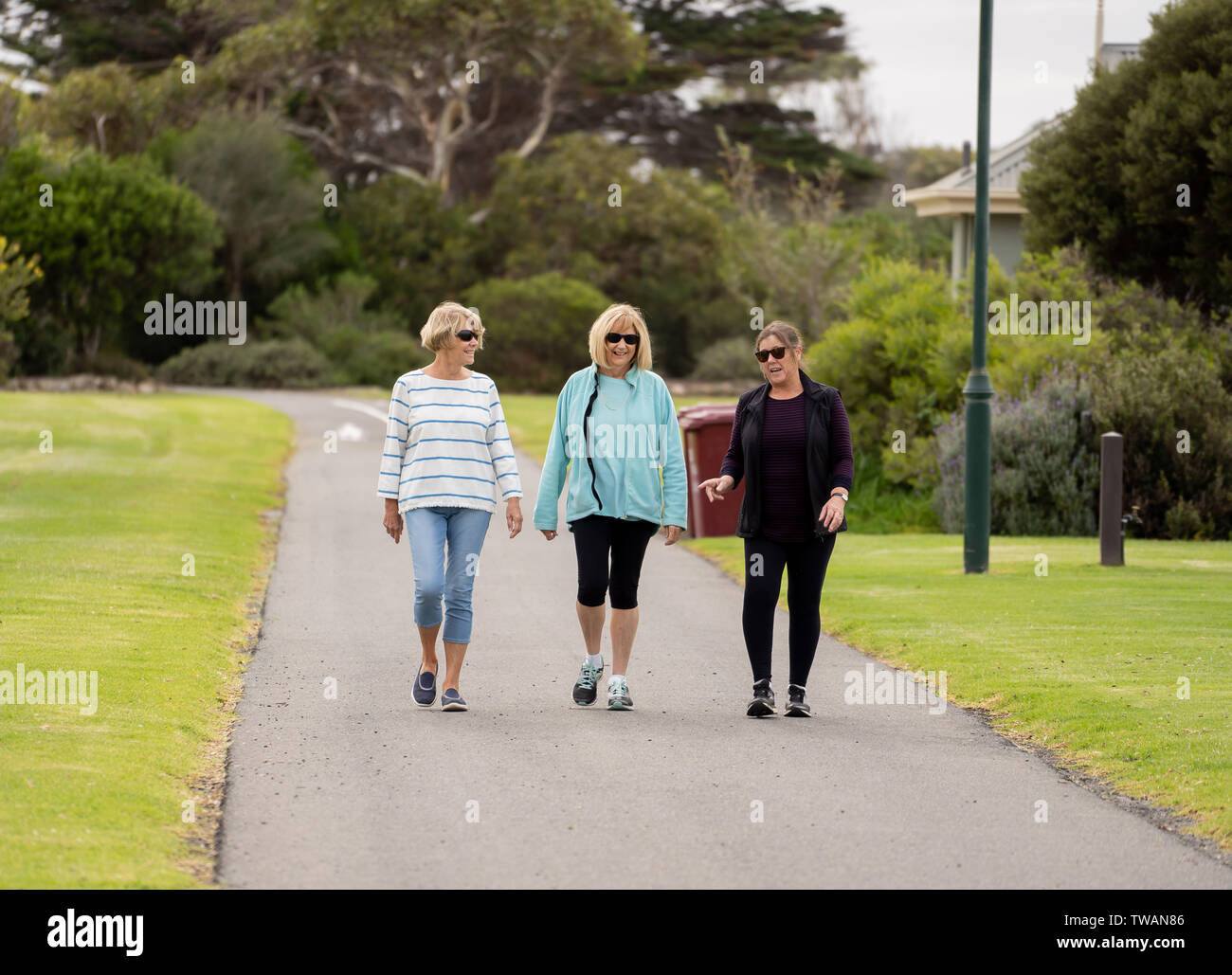 Lovely group of three senior mature retired women on their 60s walking ...