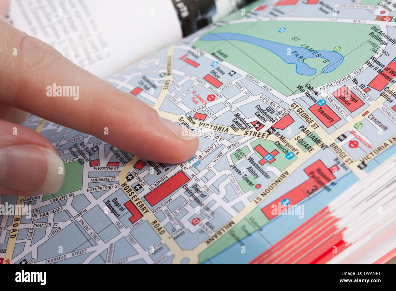 A finger pointing at a location on a London Map, London, England, UK ...