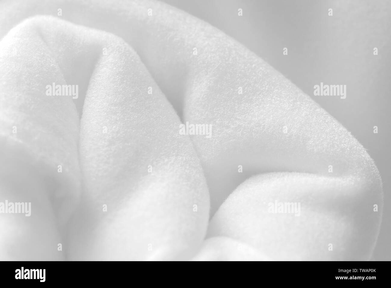 Background with white rolled fleece, soft napped insulating fabric made ...