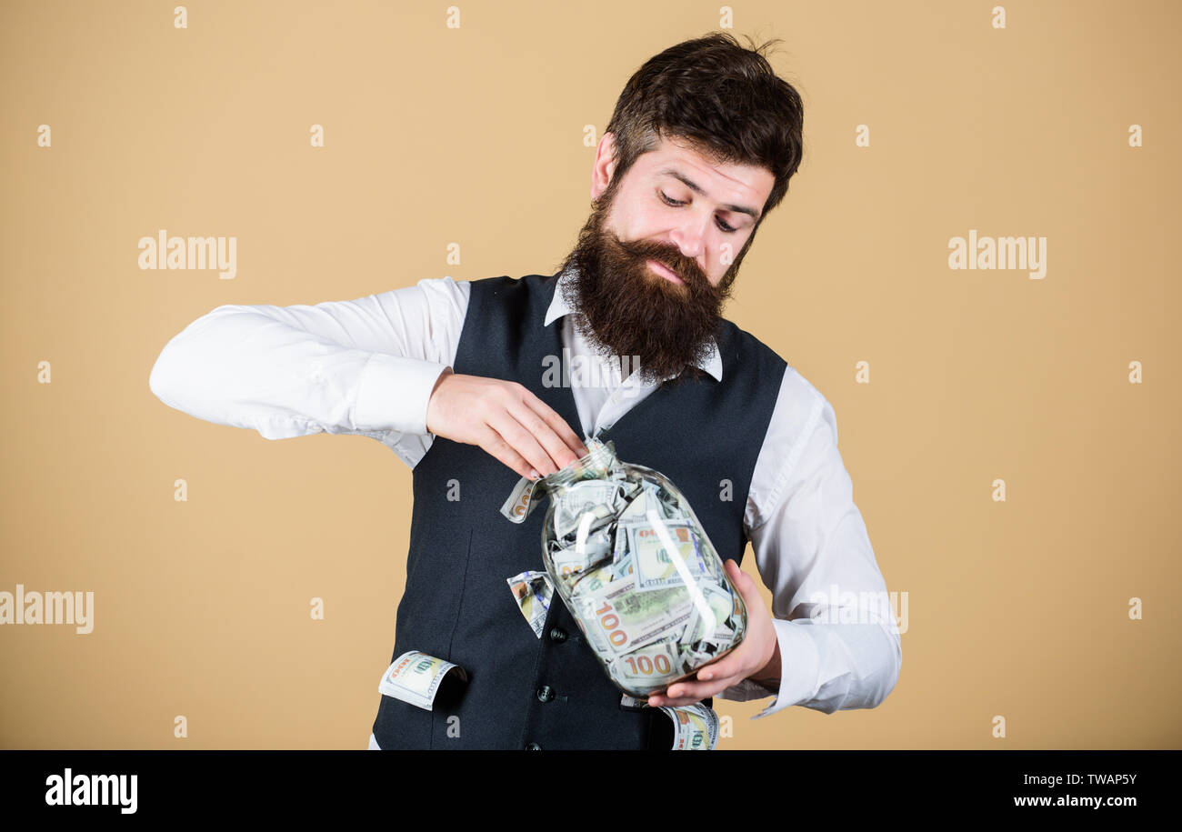 Making his savings in dollar. Businessman taking dollar cash out of ...