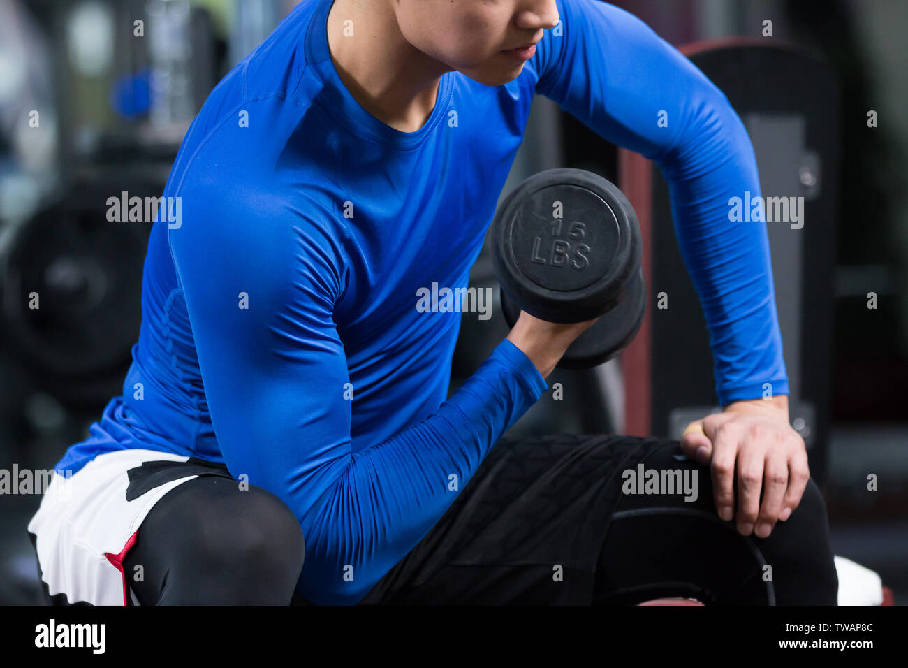 young asian man working out in modern gym Stock Photo - Alamy