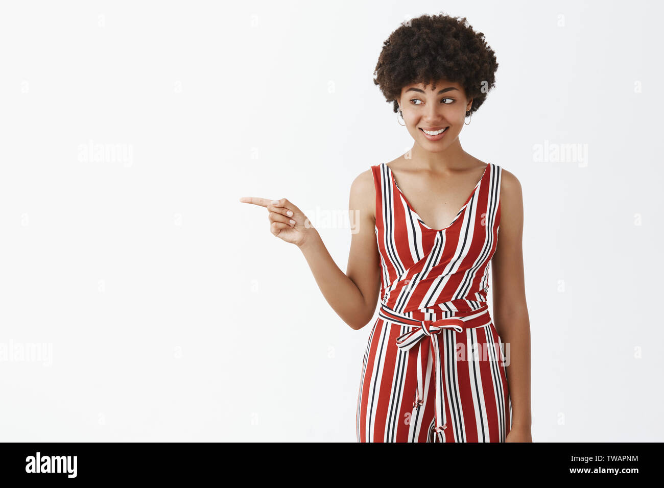 Woman pointing at guy she secretly in love with, feeling shy, blushing ...