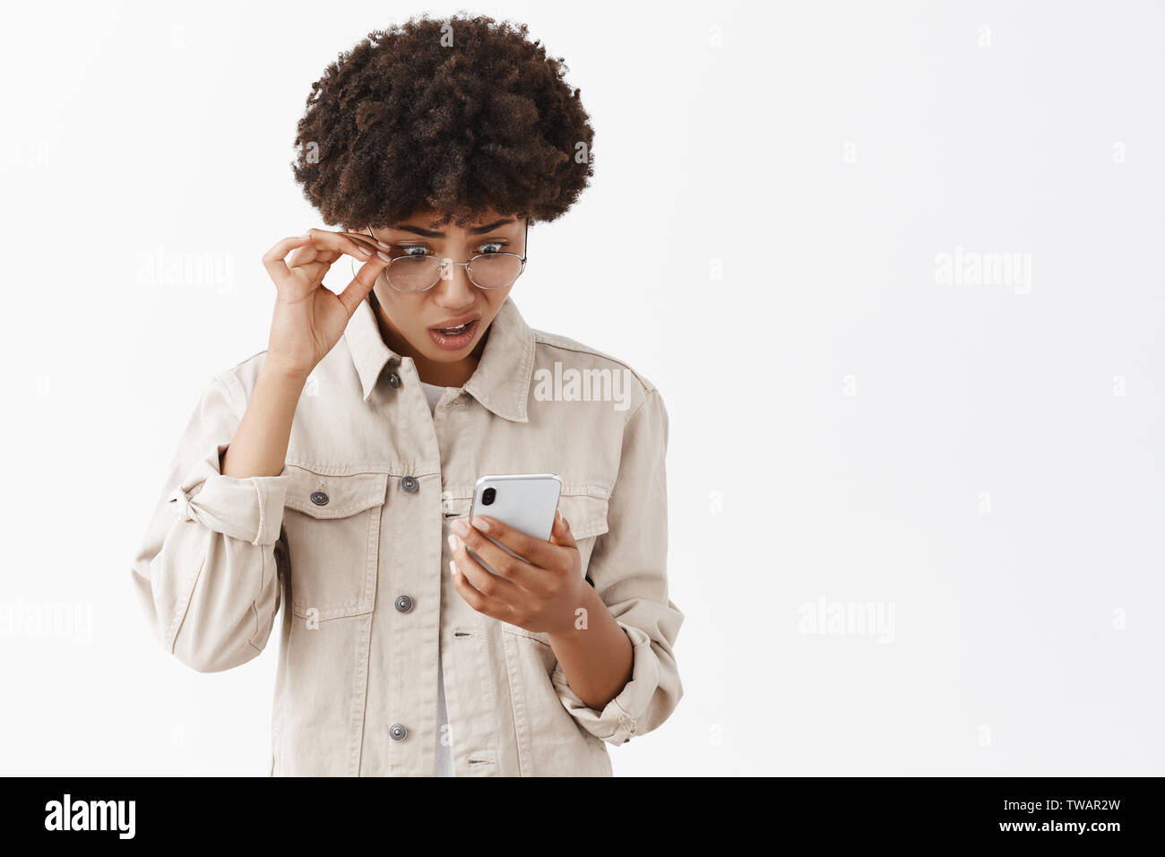 What the heck. Portrait of confused and questioned intense African ...