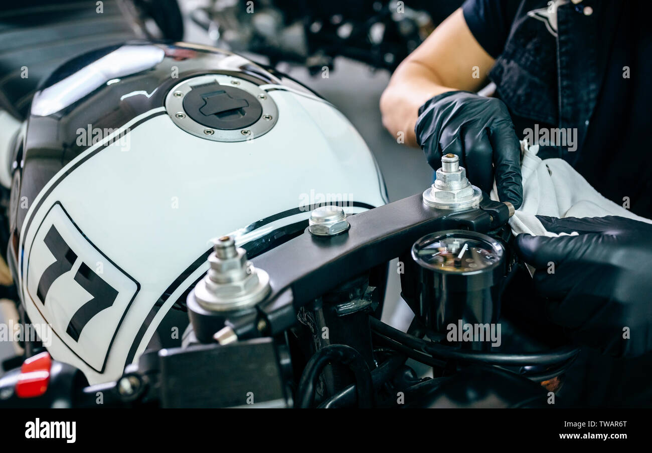 Mechanic working motorcycle workshop High Resolution Stock Photography ...