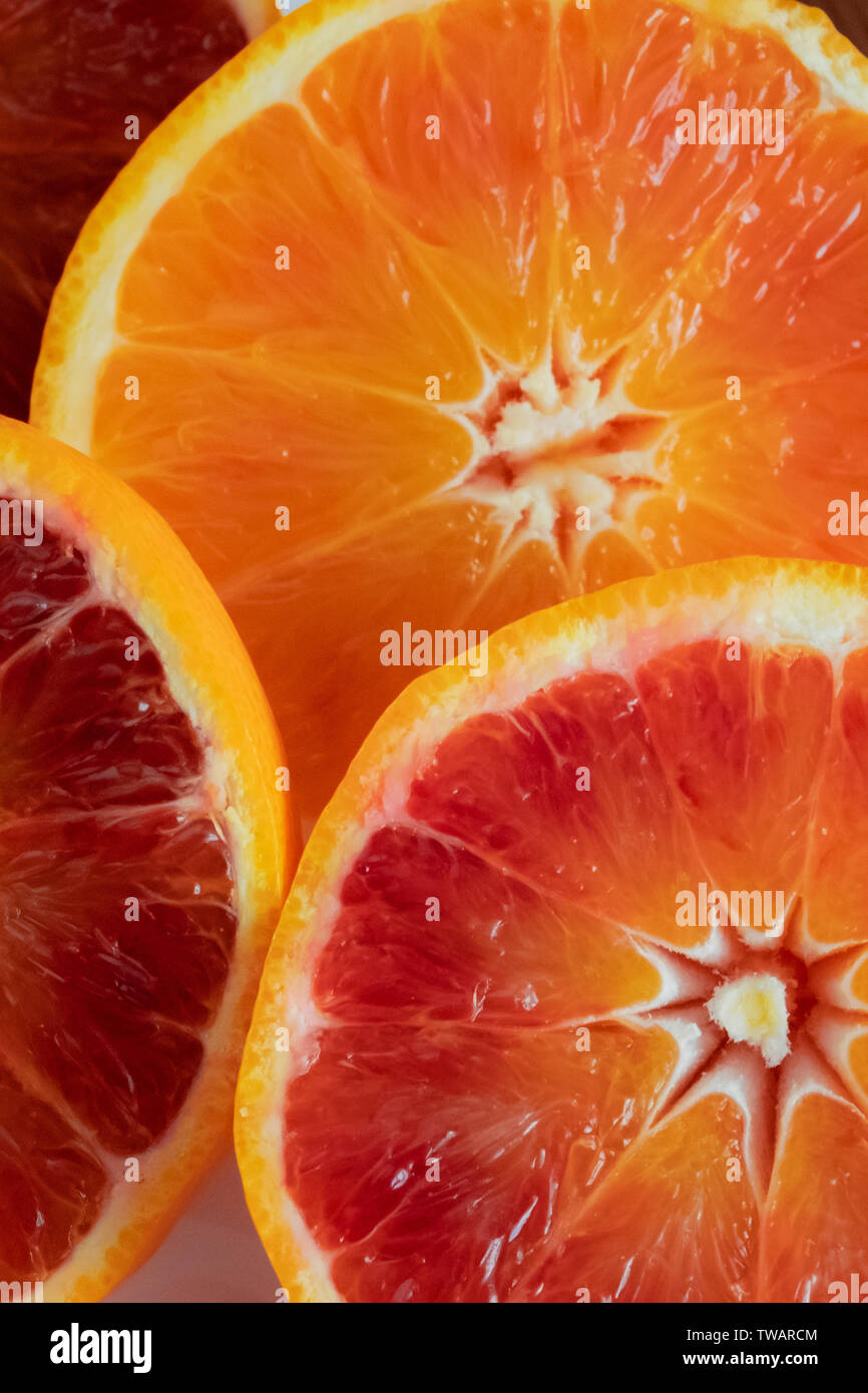Close up of ripe juicy blood orange halves Stock Photo - Alamy