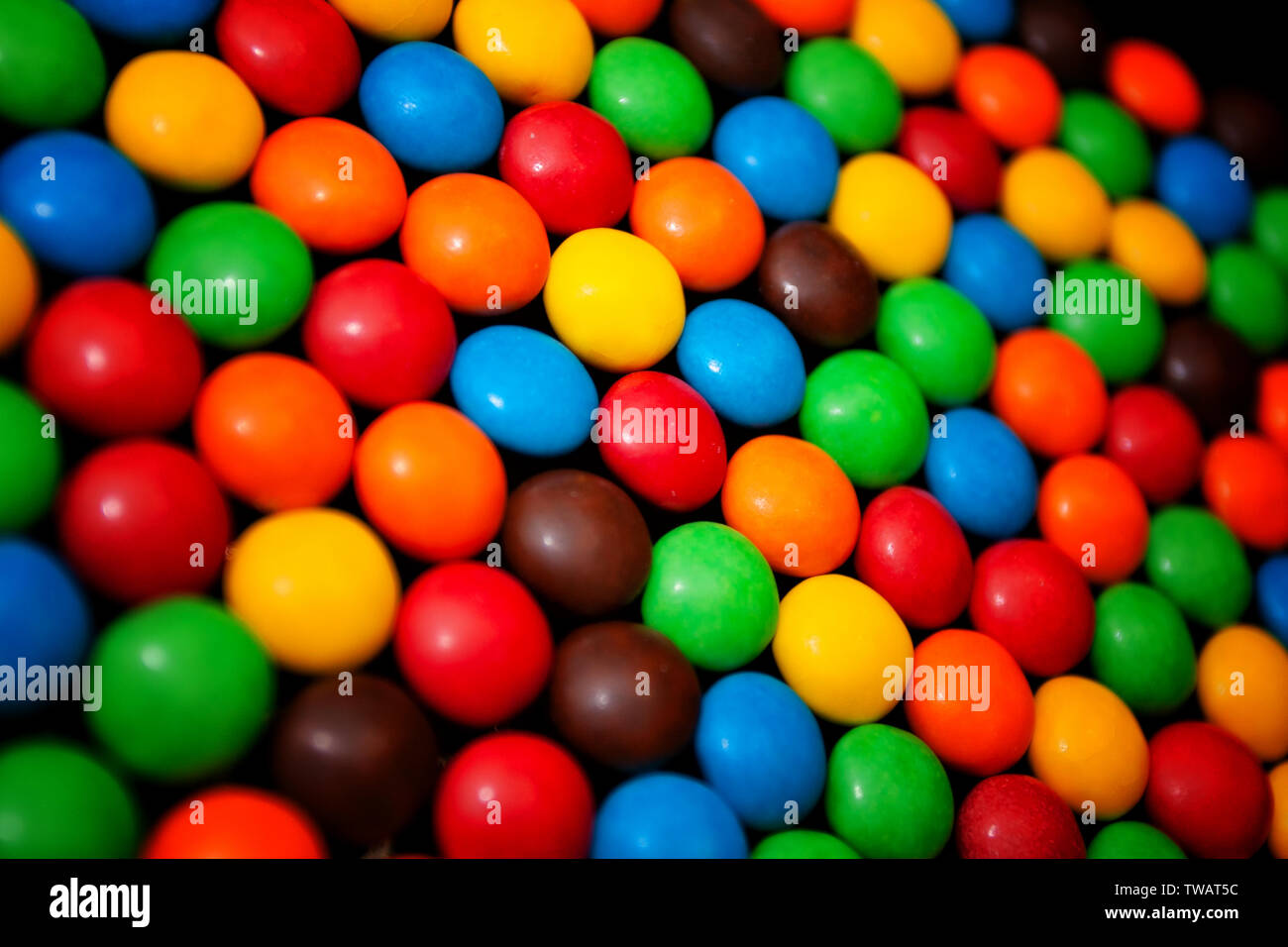 Colorful chocolate dragees for background Stock Photo - Alamy
