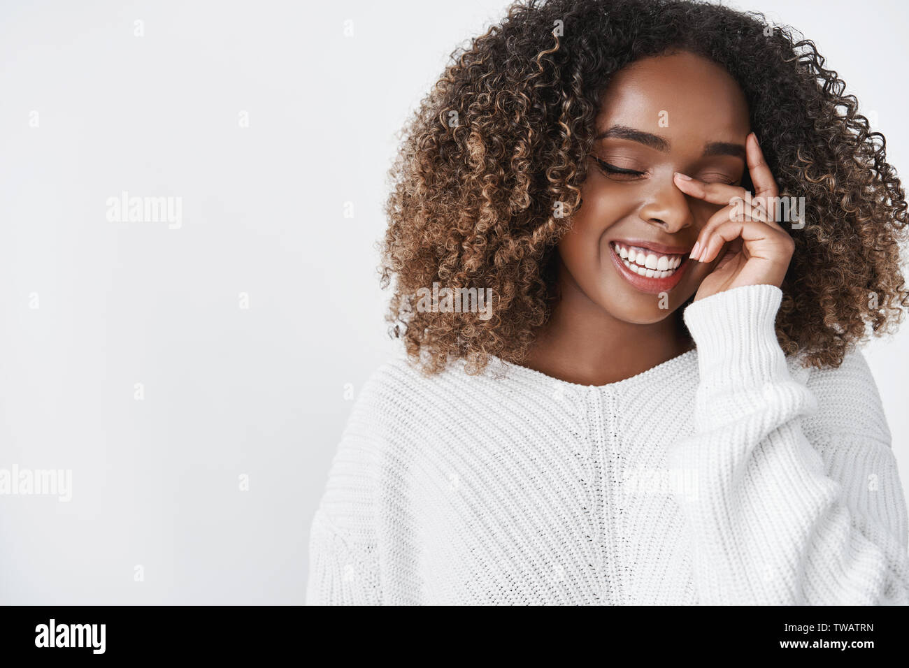 Tender and gentle good-looking feminine dark-skinned girl with curly ...