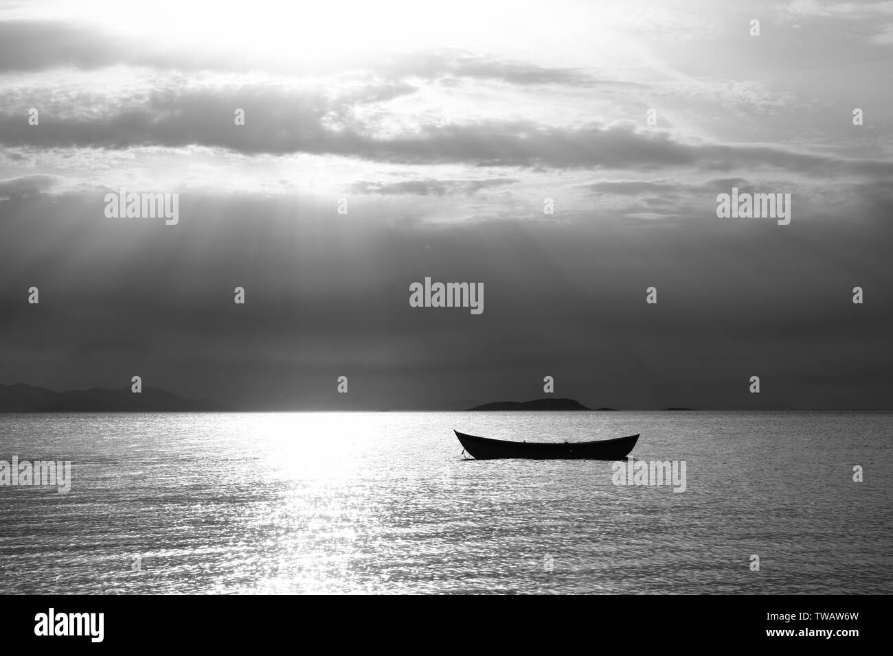 Sunset in the sea with a boat. A picture of a small boat with a ...