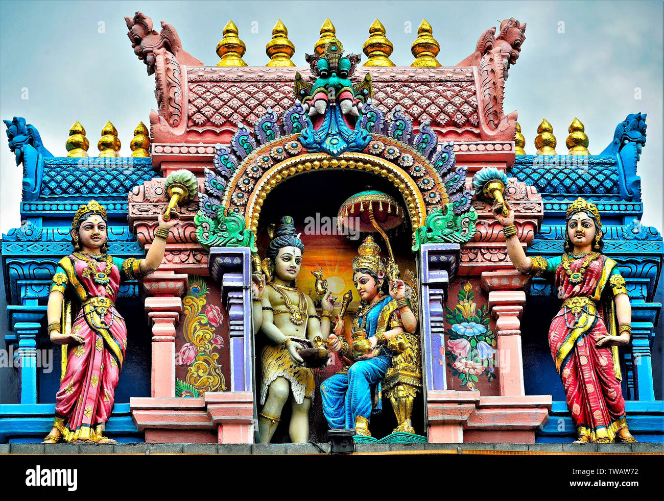Colourful statues of Hindu religious deities adorning the entrance of ...