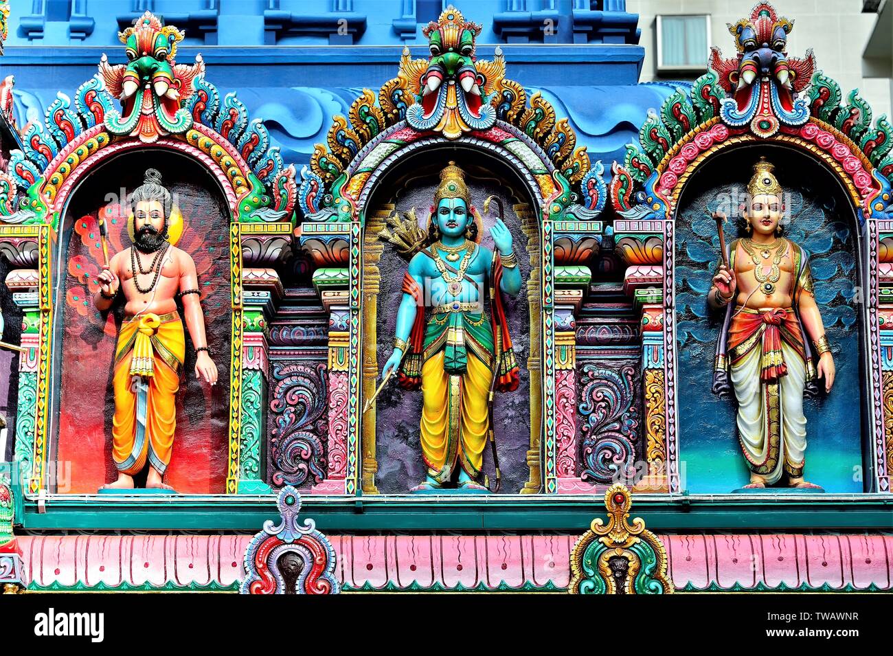 Colourful statues of Hindu religious deities adorning the entrance of ...