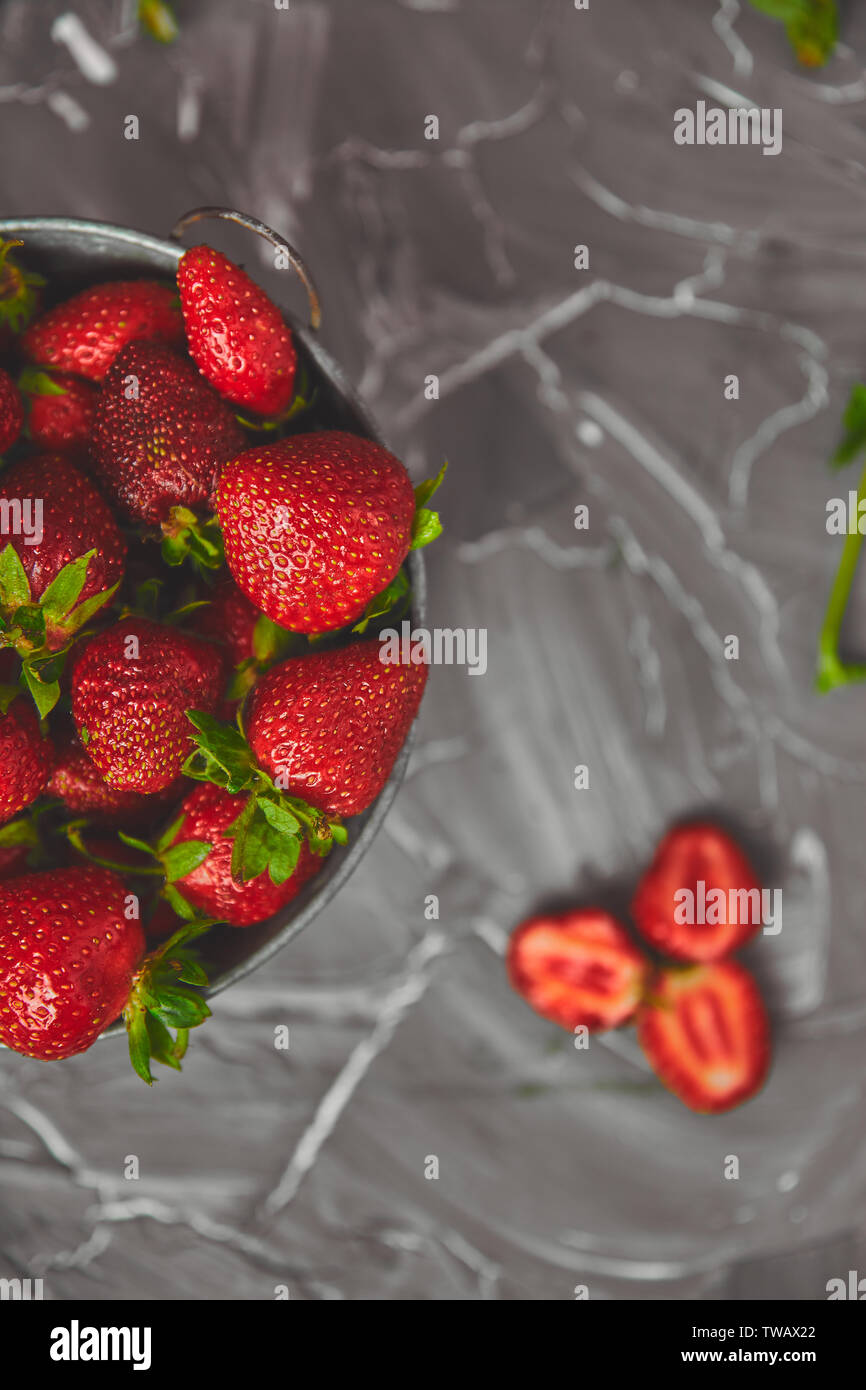 Ripe red strawberries on black table, Strawberries in white bowl. Fresh ...