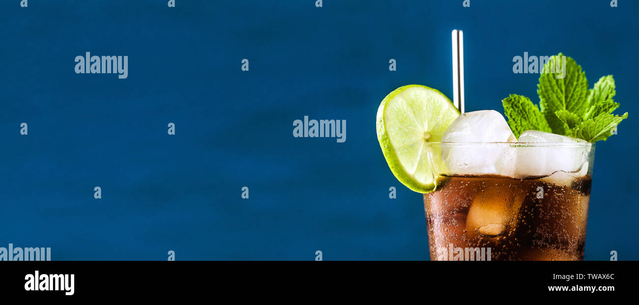banner of Coca Coke cocktail in a tall glass cuba libre. refreshing ...