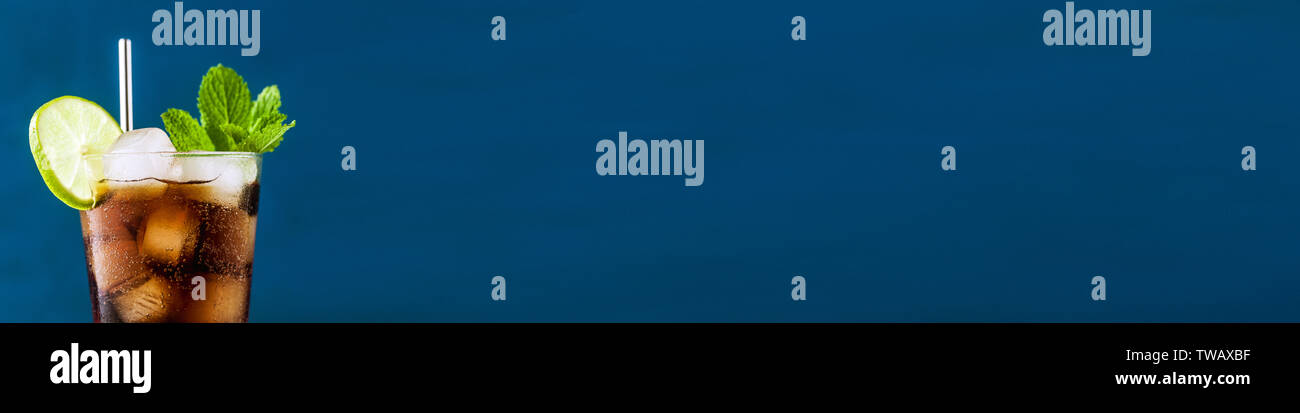 banner of Coca Coke cocktail in a tall glass cuba libre. refreshing ...