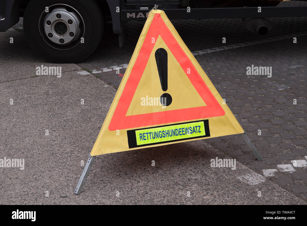 Warning triangle rescue dog insert Stock Photo - Alamy