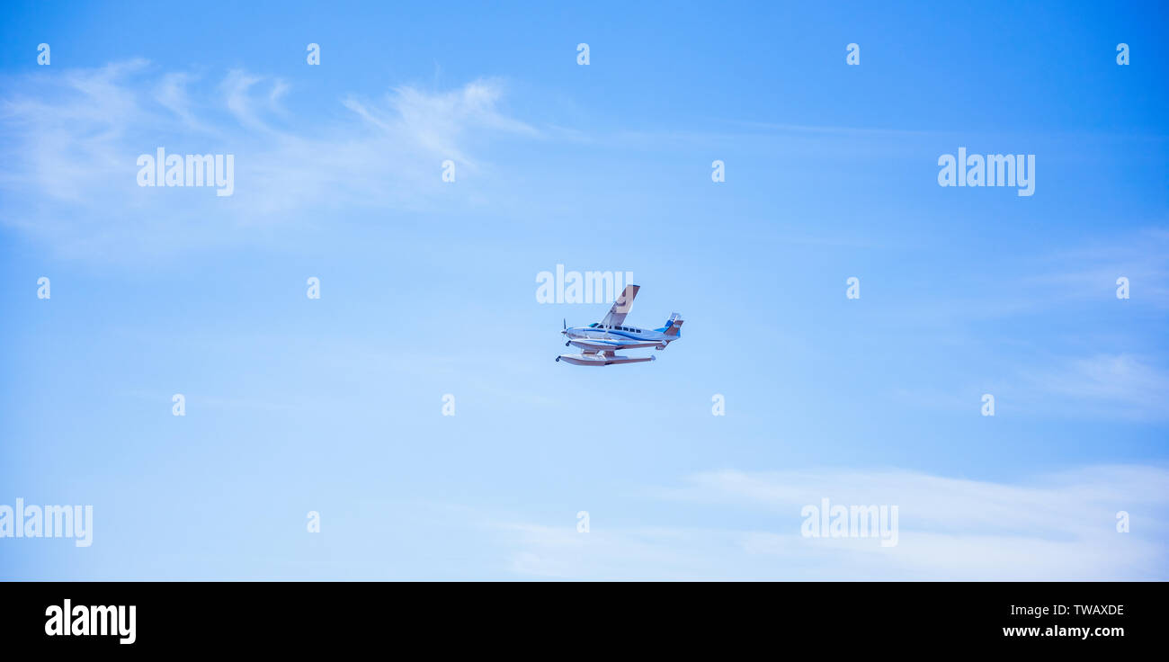 Small plane flying over mountain hi-res stock photography and images ...