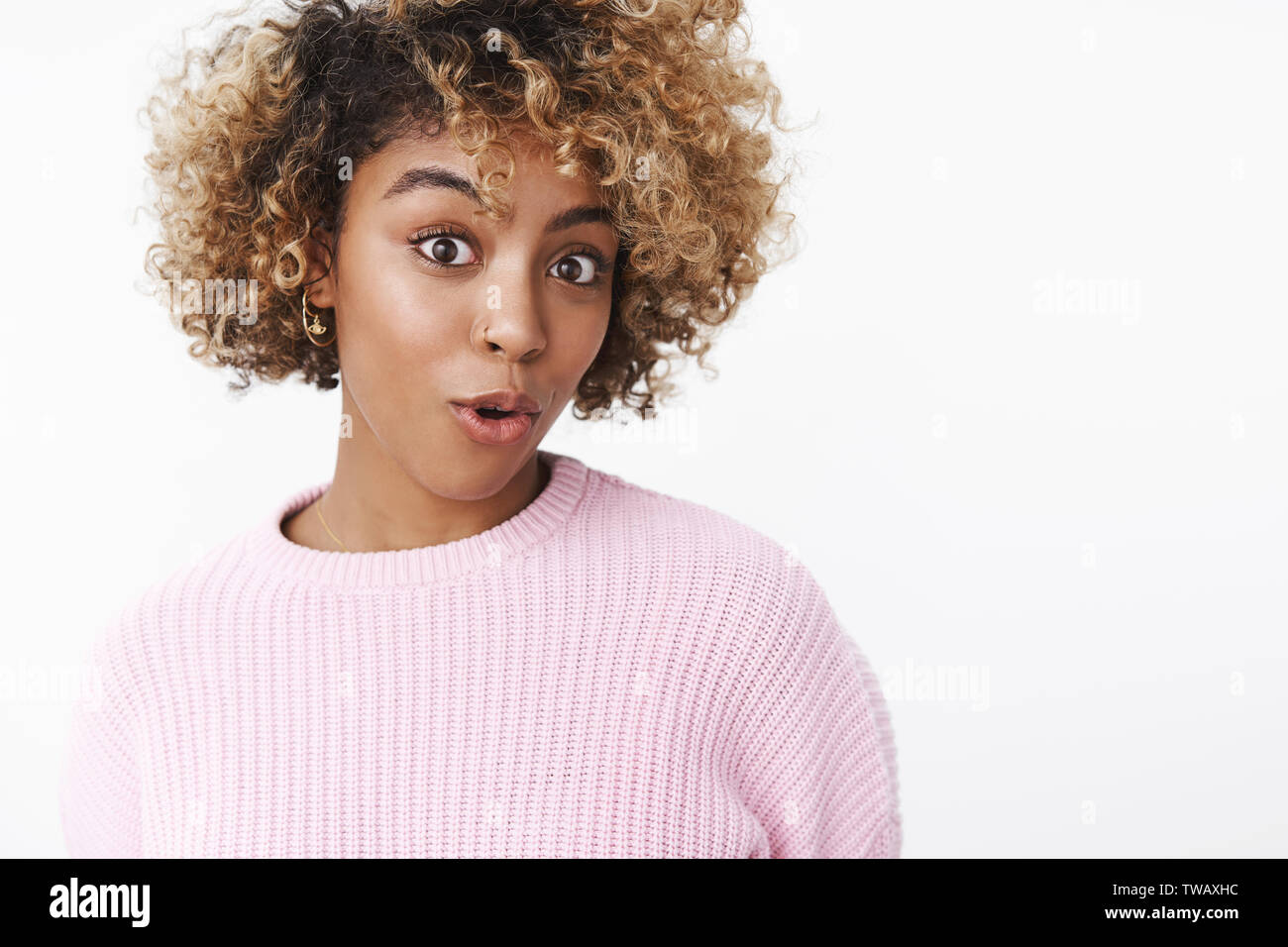 Girl wondering as feeling surprised hearing interesting rumor folding ...
