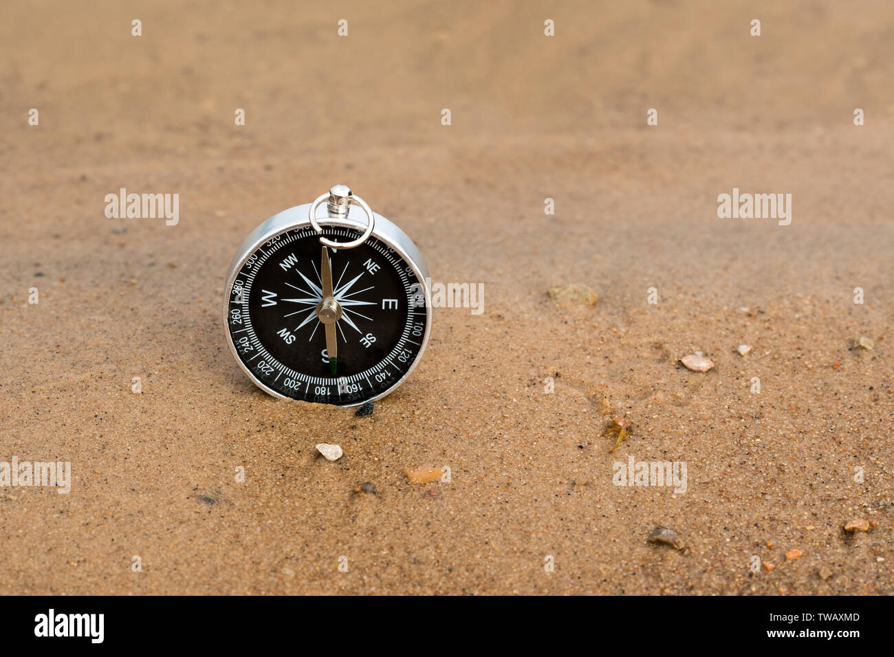 Compass sandy beach hi-res stock photography and images - Alamy