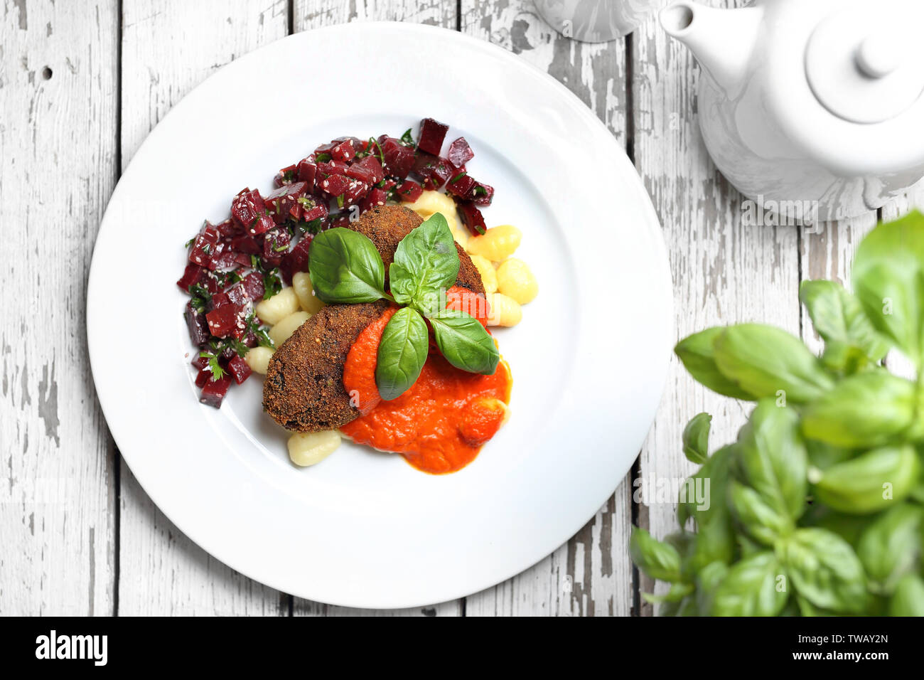 Appetizing dinner dish, vegetarian dish served on a white plate ...