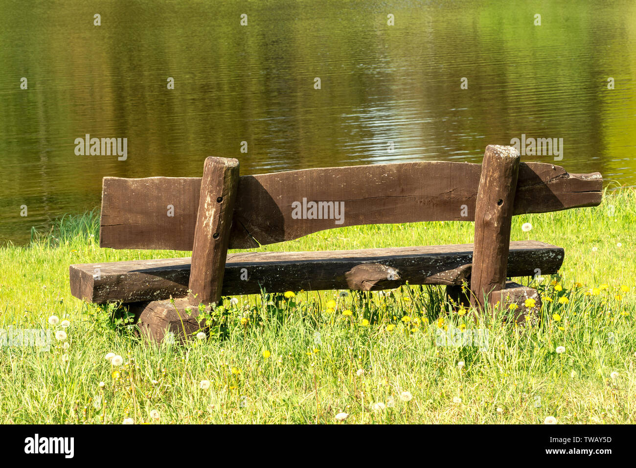 Empty wooden bench with lake view Stock Photo - Alamy
