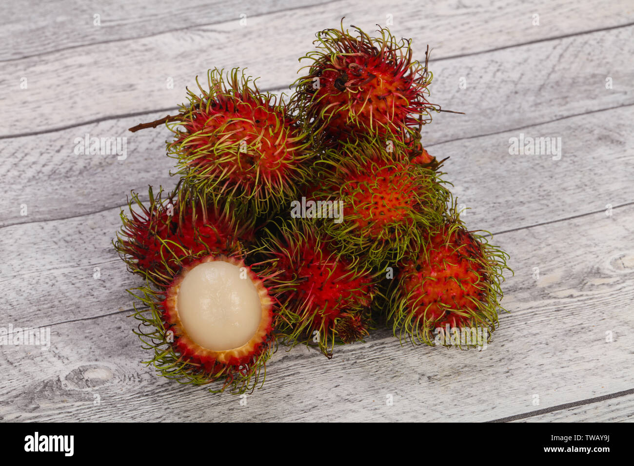 Tropical sweet exotic fruit Rambutan heap Stock Photo - Alamy