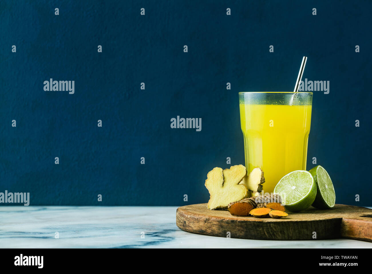 golden ginger and turmeric drink with lime juice. Healthy anti ...