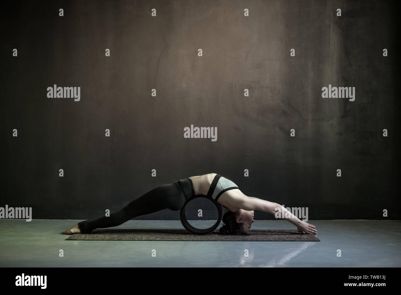 Woman practices yoga asana Matsyasana fish pose Stock Photo - Alamy