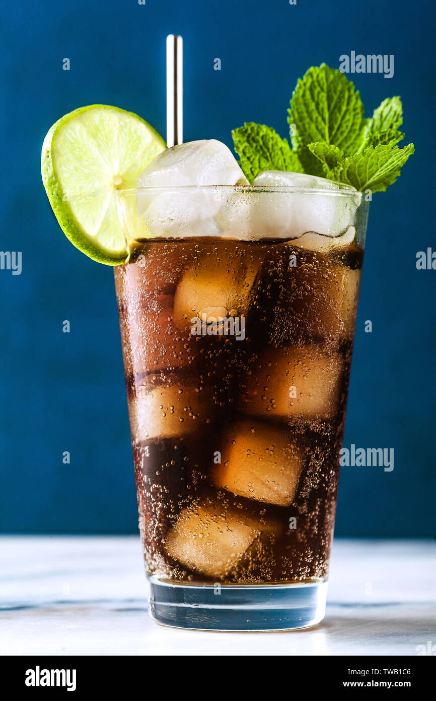 Coca Coke cocktail in a tall glass cuba libre. refreshing summer drink ...