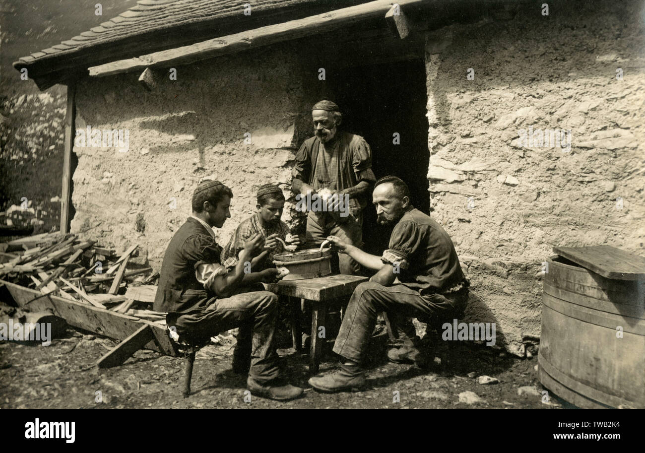 Alpine Dairy Herdsmen (Sennen) eat their evening meal Stock Photo - Alamy