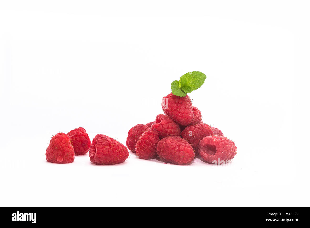 Fresh raspberries on white background Stock Photo - Alamy