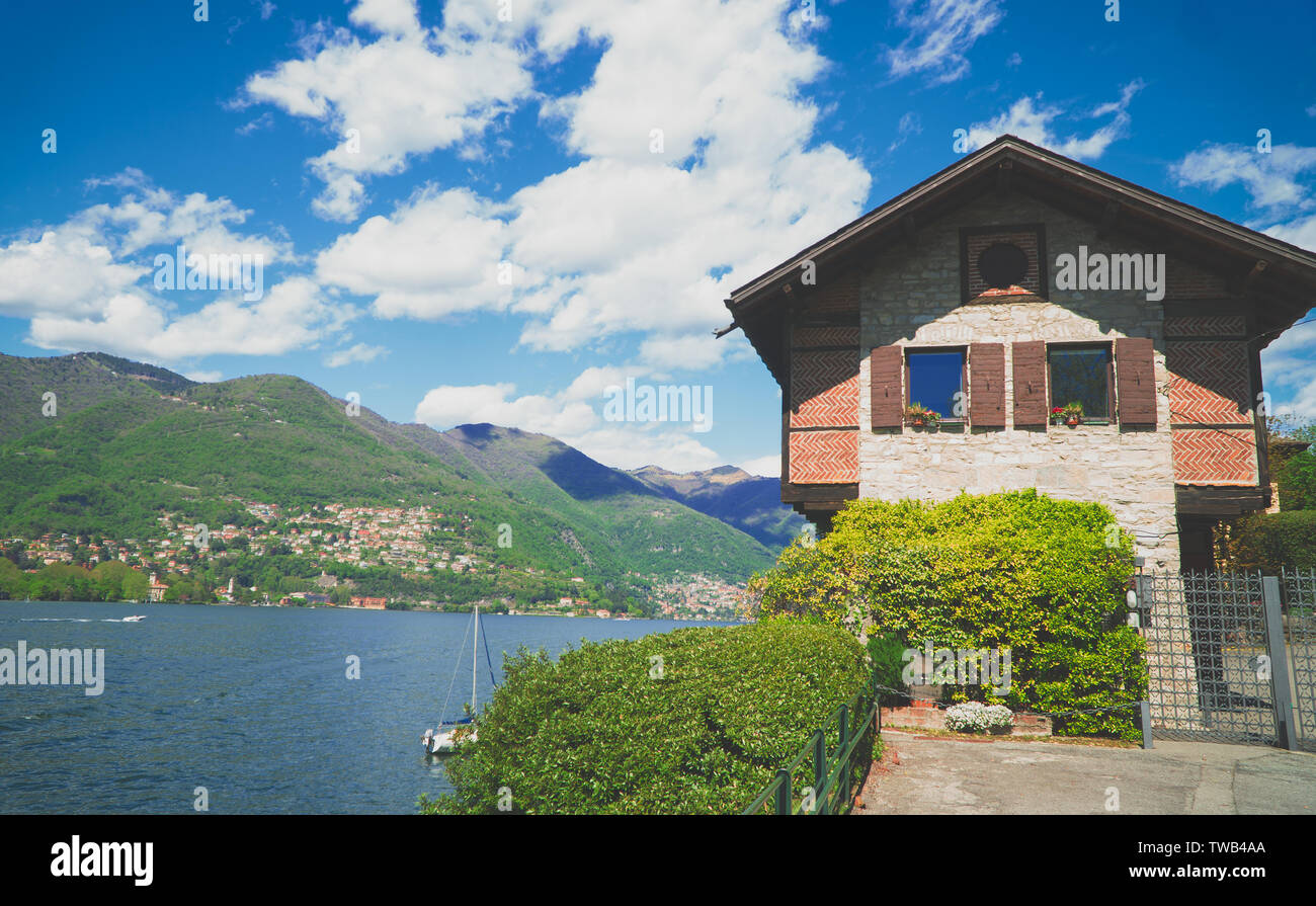 Beautiful house in the old style on the lake in the mountains Stock ...