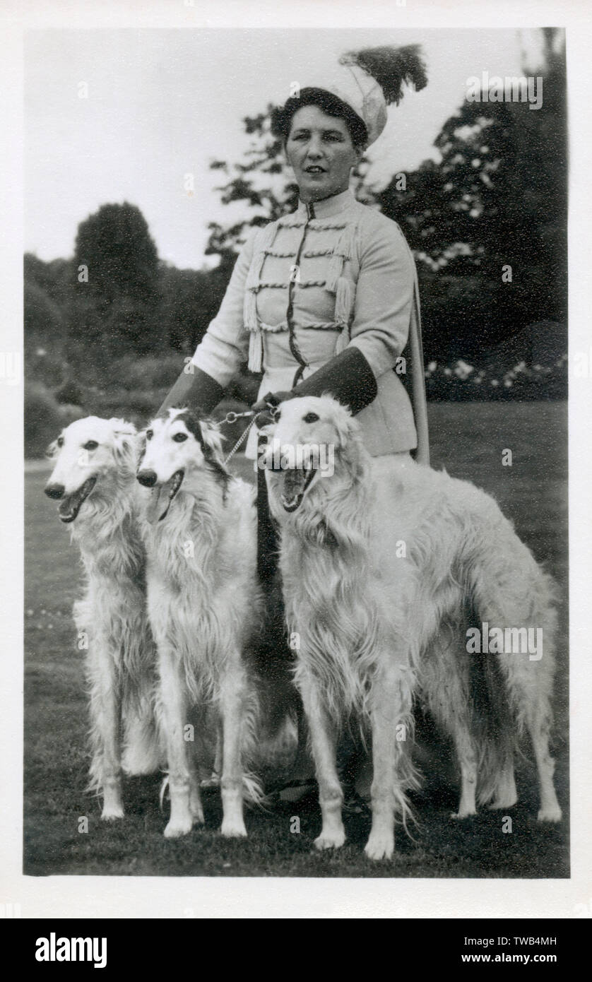 Lady in elaborate costume with three Borzois Stock Photo - Alamy