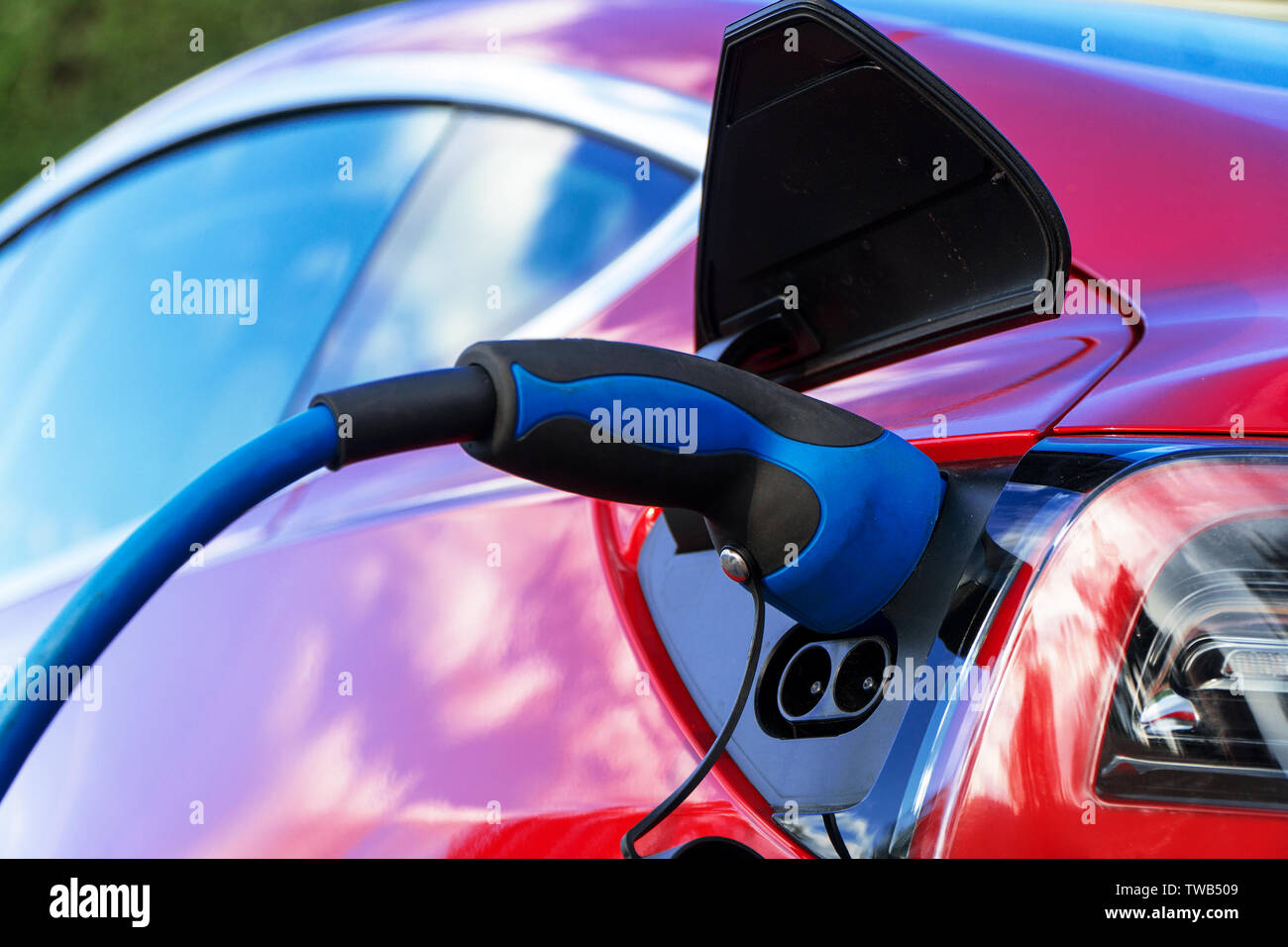 Red electric sports car charging hi-res stock photography and images ...