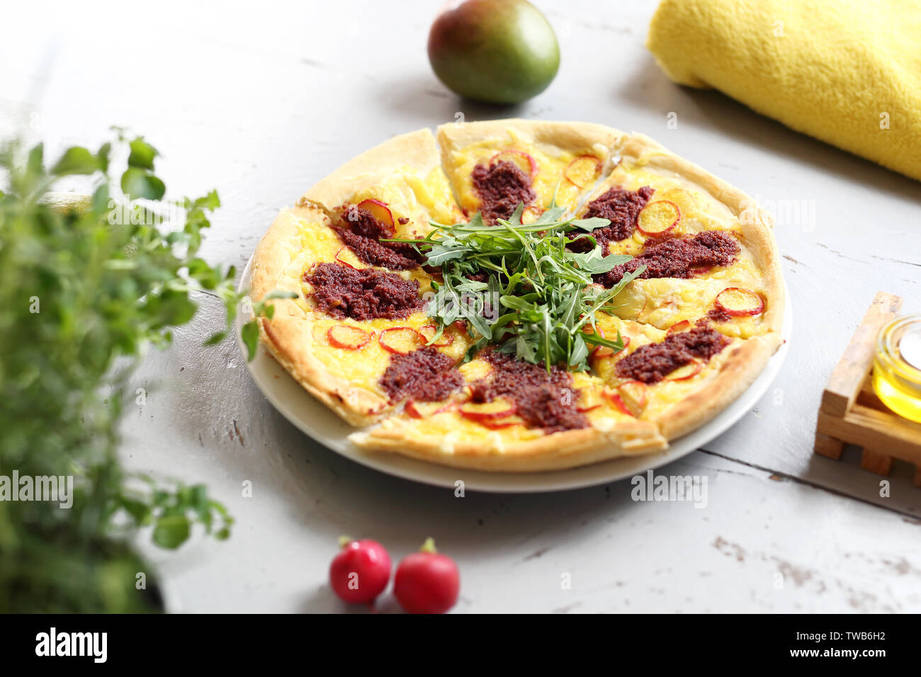 Vegetarian pizza with vegetables, green arugula and tomato pulp ...
