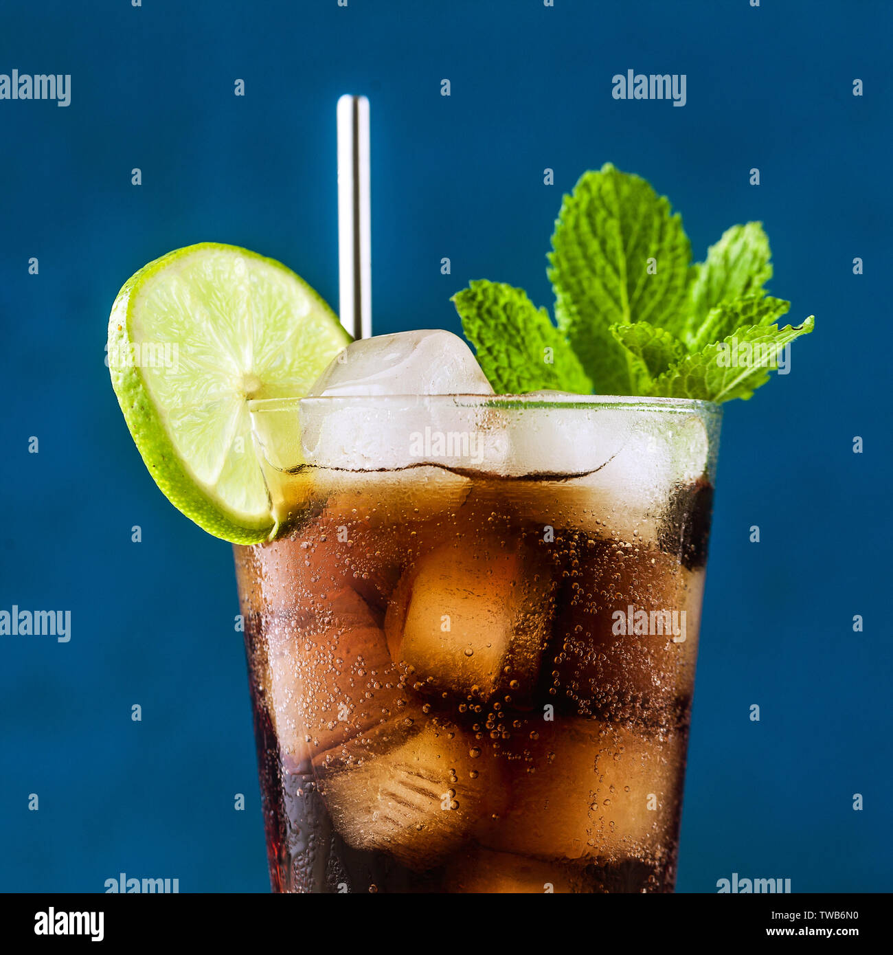 Coca Coke cocktail in a tall glass cuba libre. refreshing summer drink ...