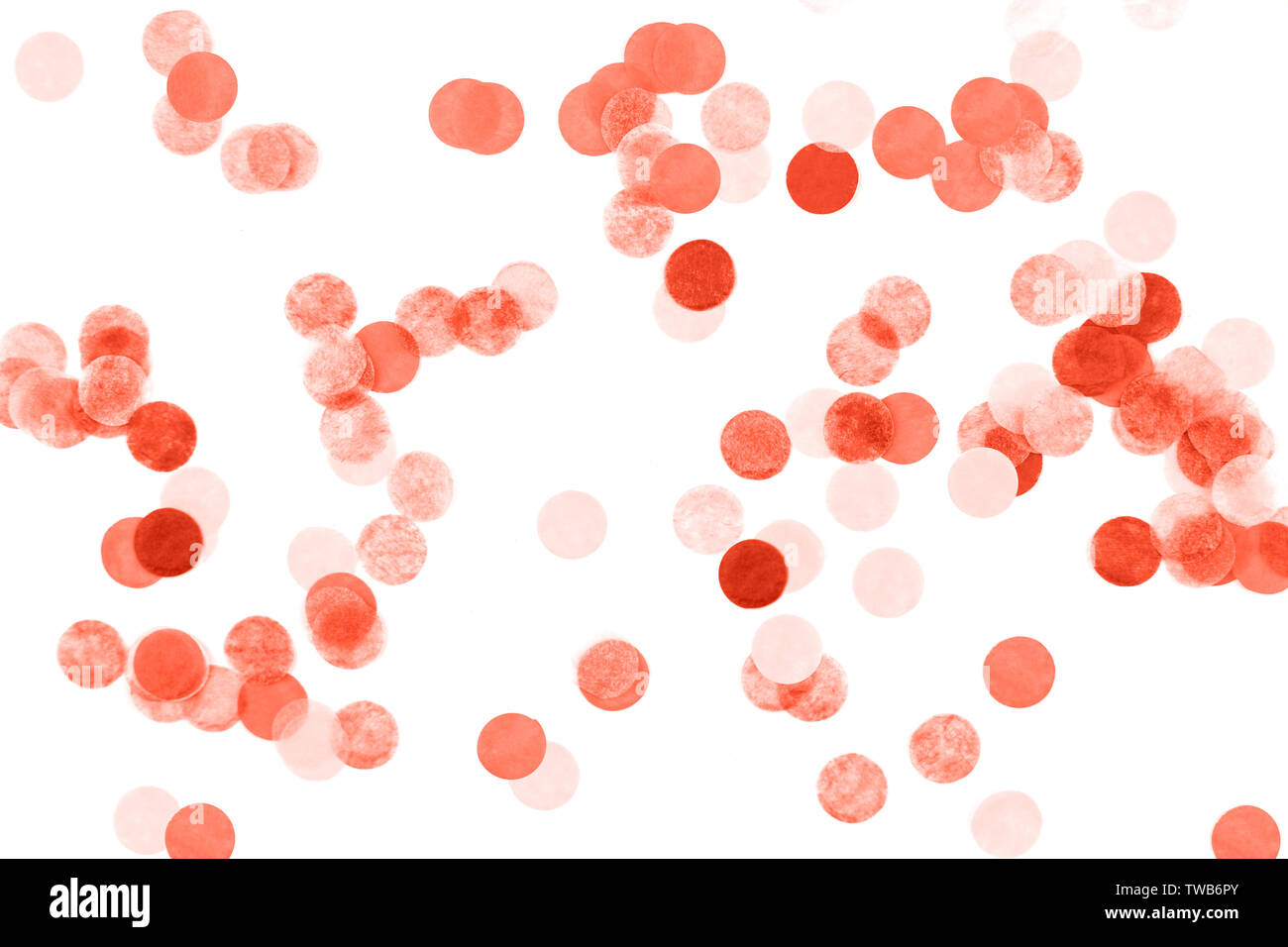 Bright coral confetti isolated on white background Stock Photo - Alamy