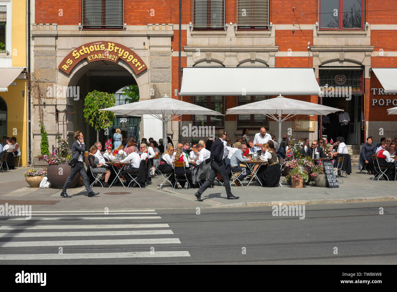 Oslo cafe bar, view of Norwegian people relaxing at terrace tables ...