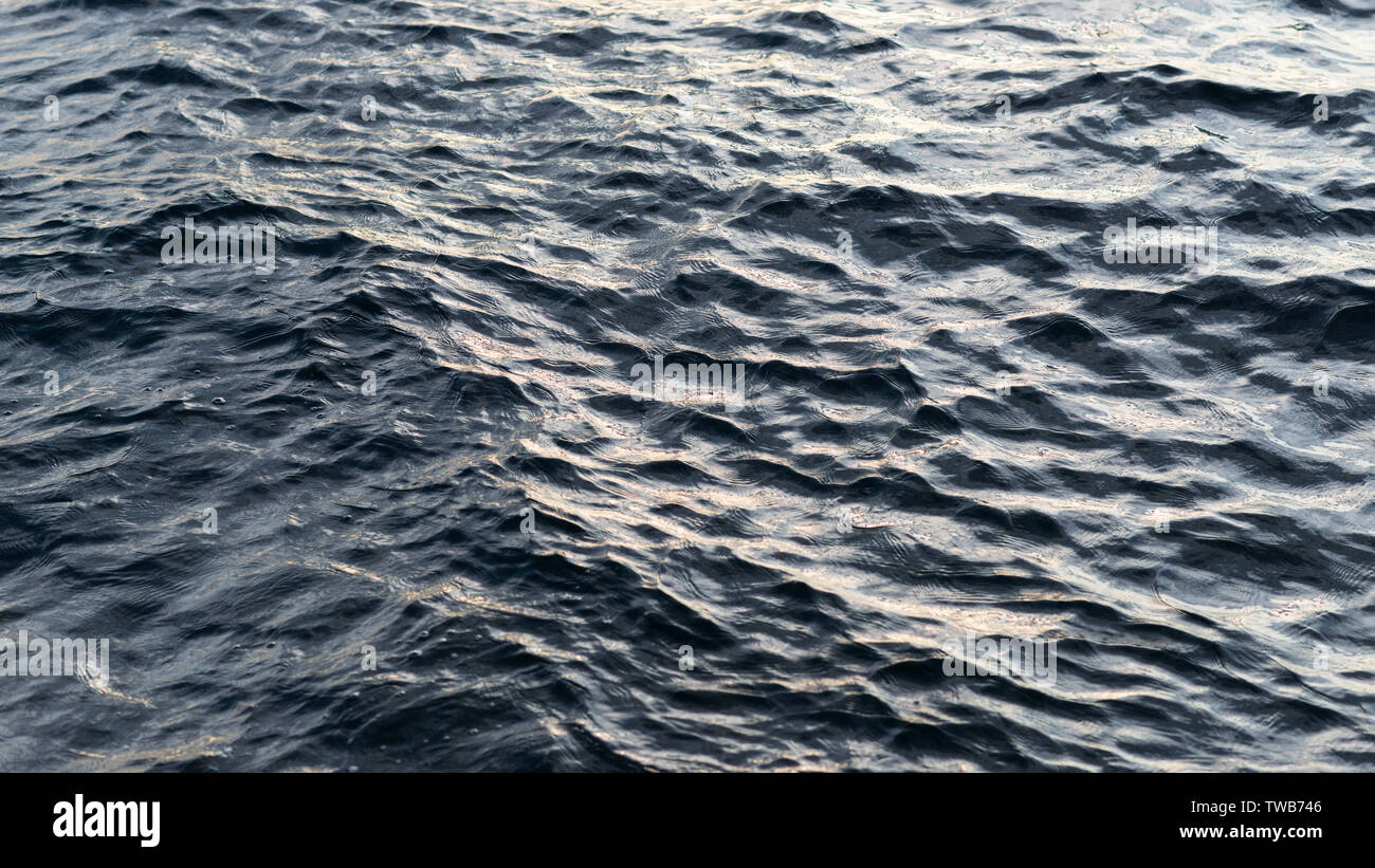 Sea surface as natural background, color toned Stock Photo - Alamy