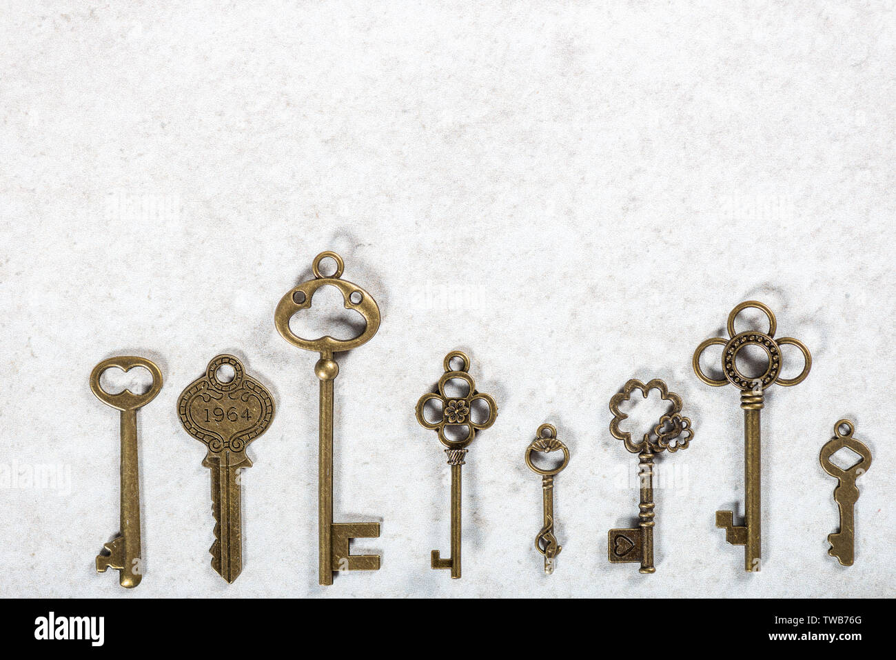 Decorative keys of different sizes and styles on grey background Stock ...