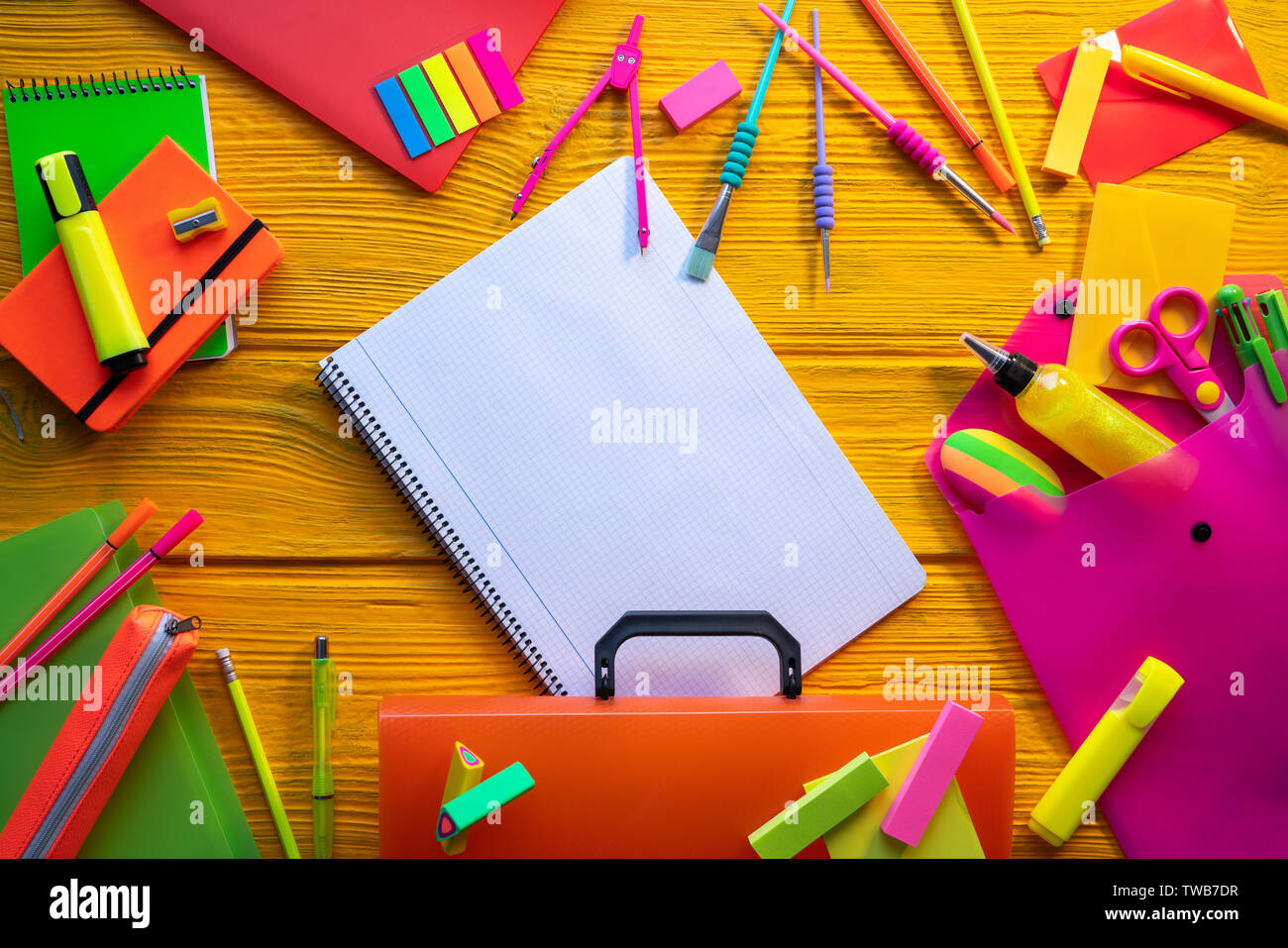 Back to school supplies arrangement vivid colorful neon color in yellow ...