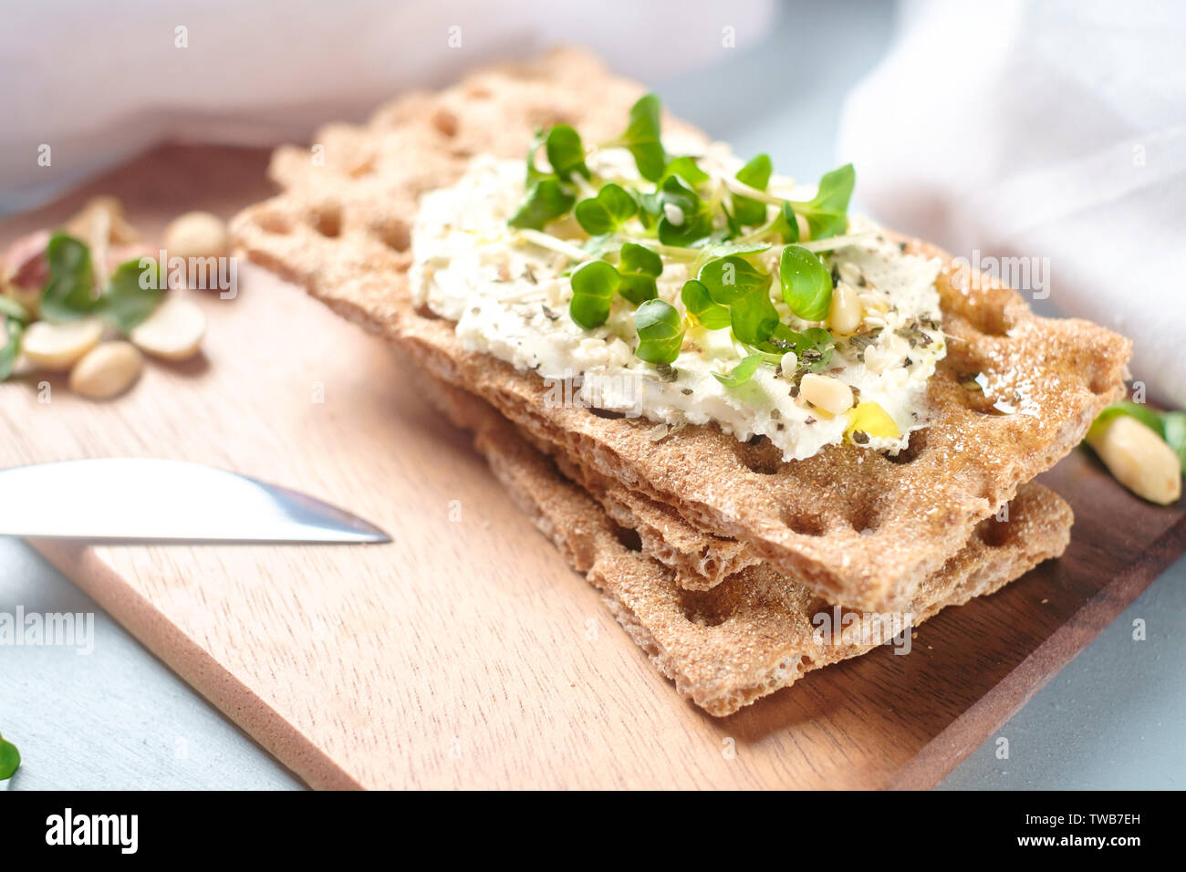Crispbread with Cream Cheese and fresh herbs on a wooden Board, Healthy ...