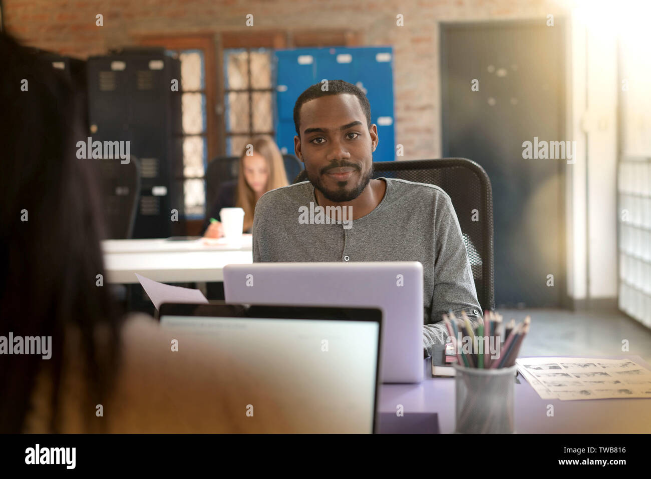 Co workers busy working in modern office space Stock Photo - Alamy