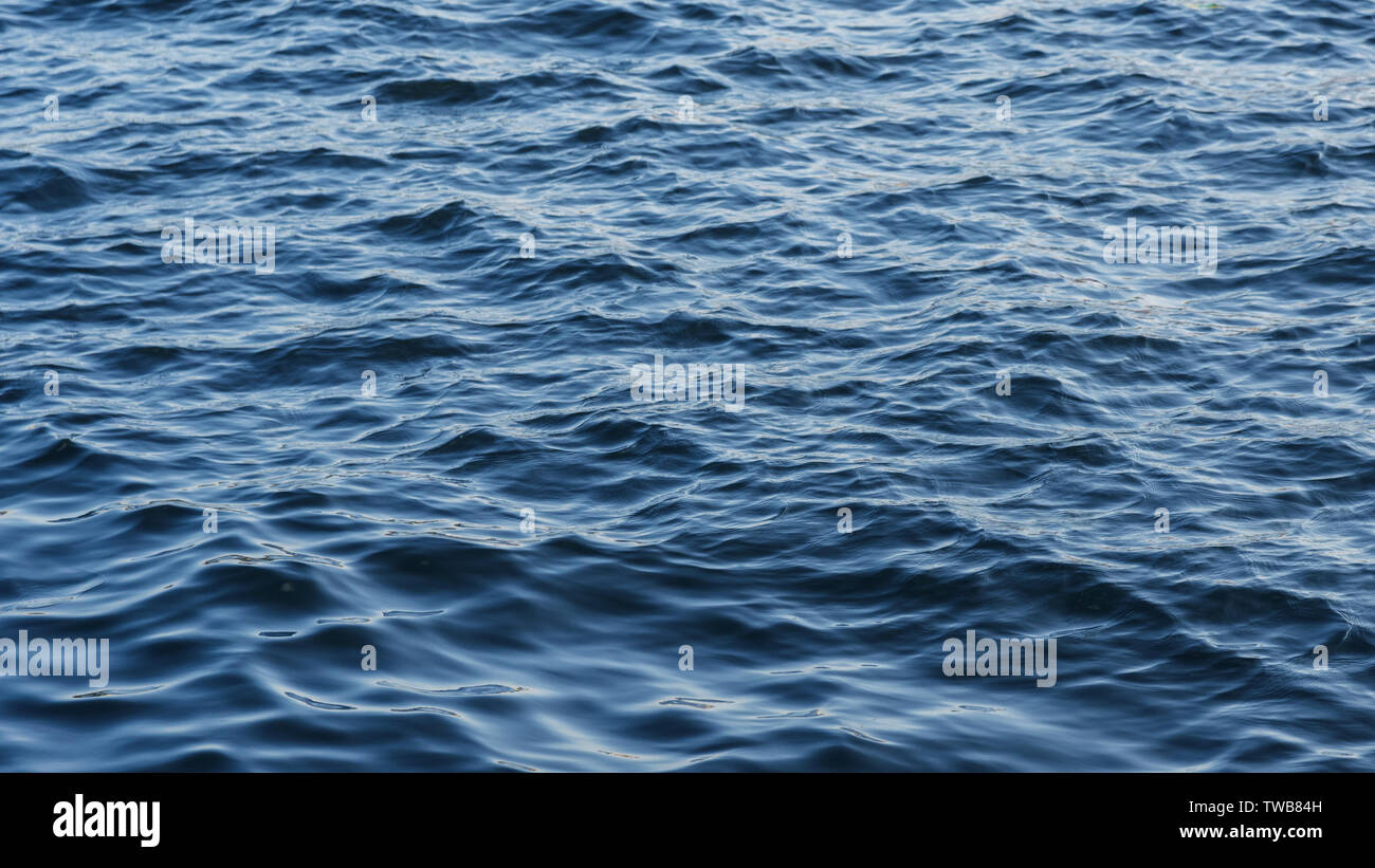 Sea surface as natural background, color toned Stock Photo - Alamy