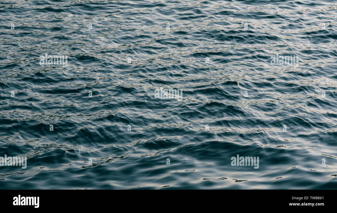 Sea surface as natural background, color toned Stock Photo - Alamy