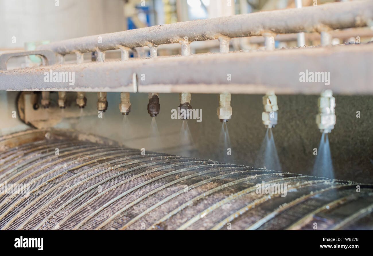 The injectors spray water on the contaminated drum. Selective focus ...