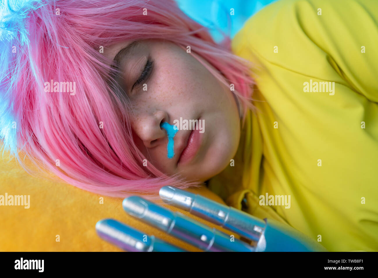 Robotic kid girl concept metal hand bleeding blue fluid from nose pink ...