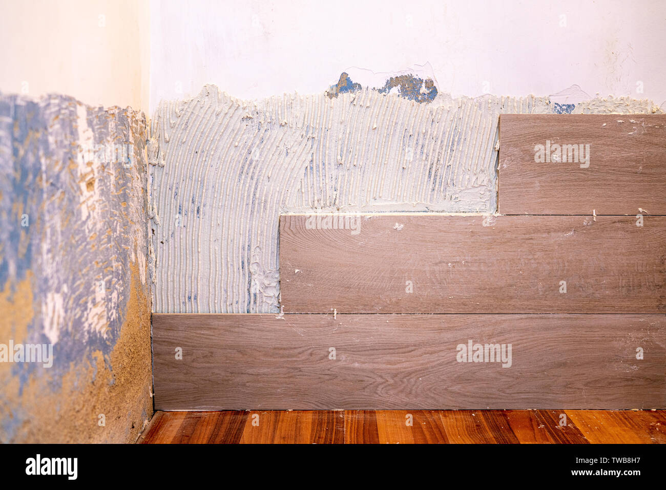 Professional mason tiling pavement indoor hi-res stock photography and ...