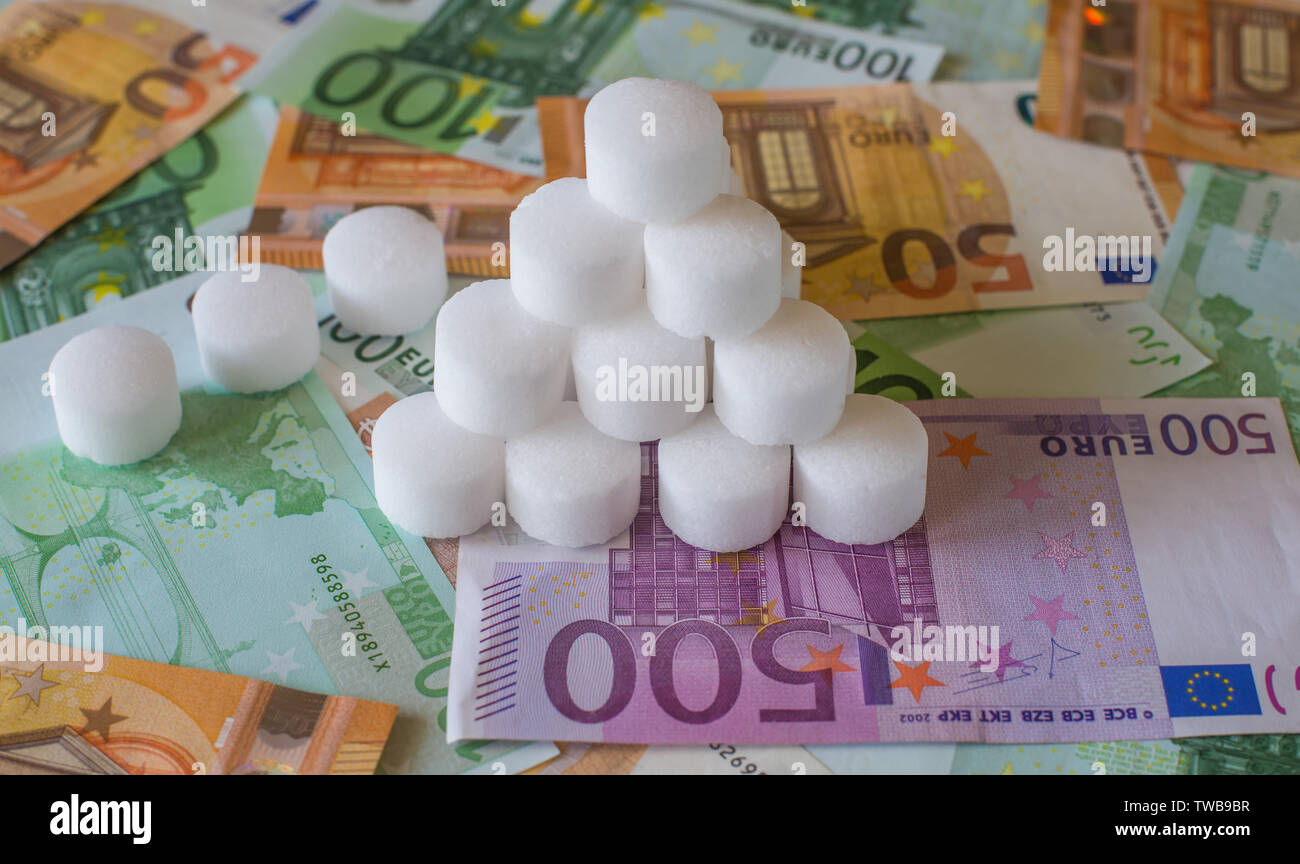 Salt white granules on the background of Euro banknotes Stock Photo - Alamy